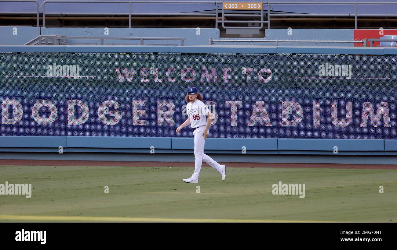 Los Angeles Dodgers starting pitcher Dustin May warms up before taking ...