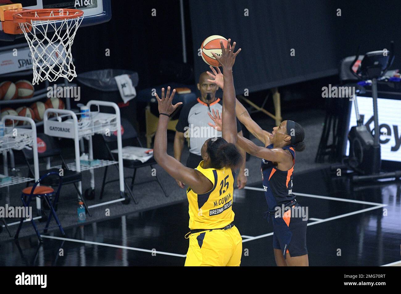 Connecticut Sun guard Jasmine Thomas, right, goes up for a shot in ...
