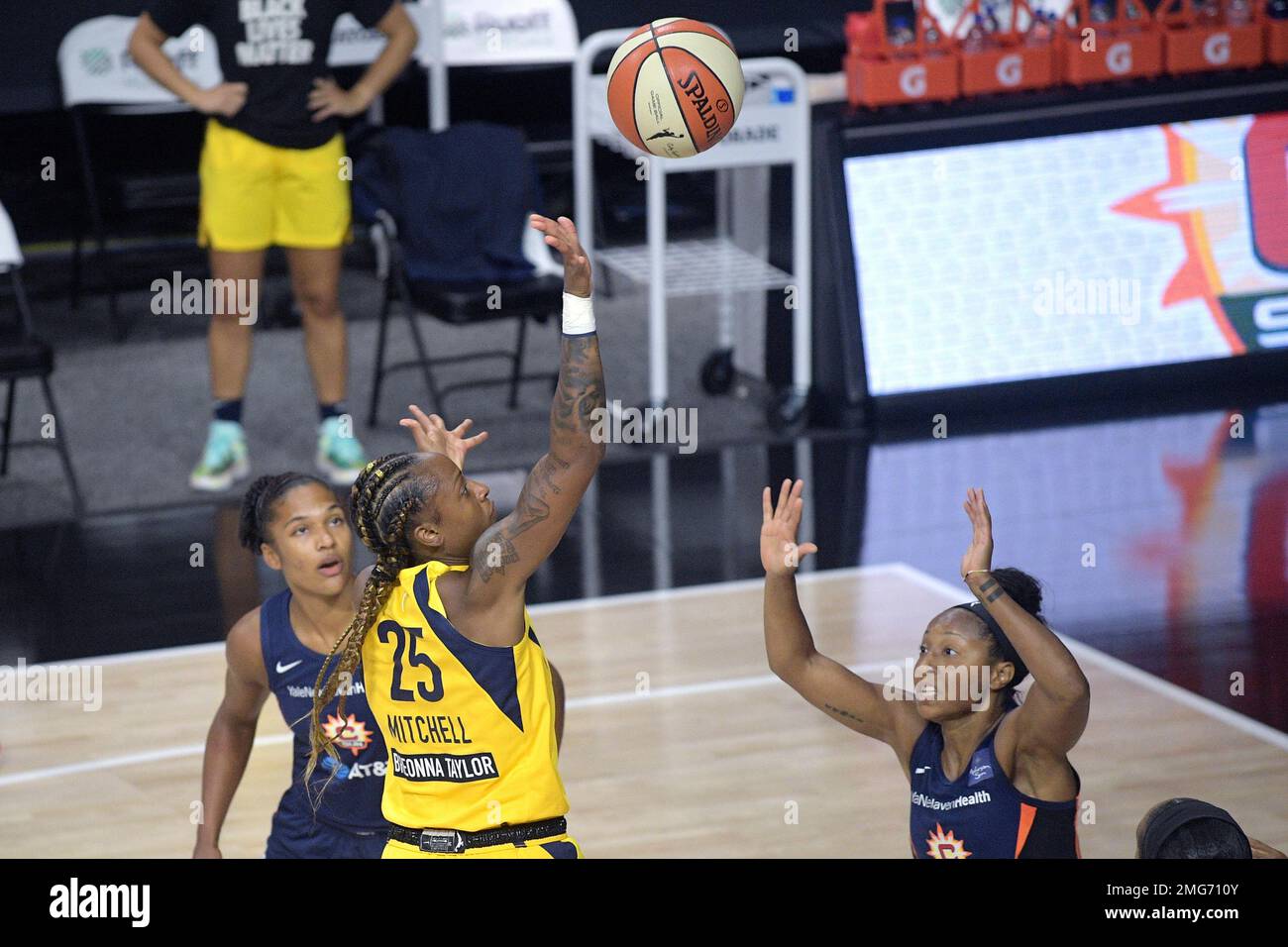 Indiana Fever guard Tiffany Mitchell (25) shoots between Connecticut ...