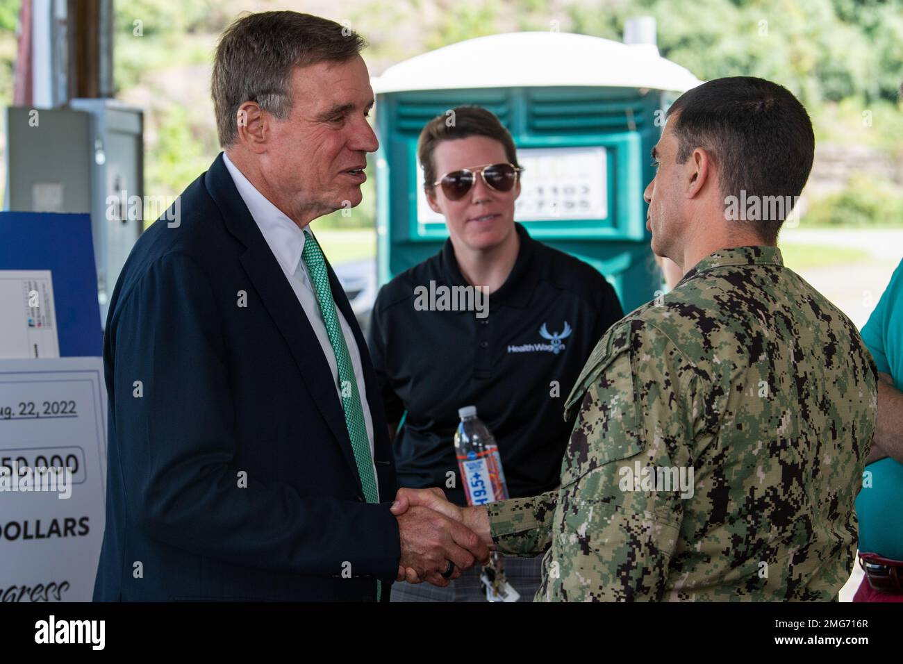 Virginia Senator Mark R. Warner speaks with U.S. Navy Cmrd. Peter ...
