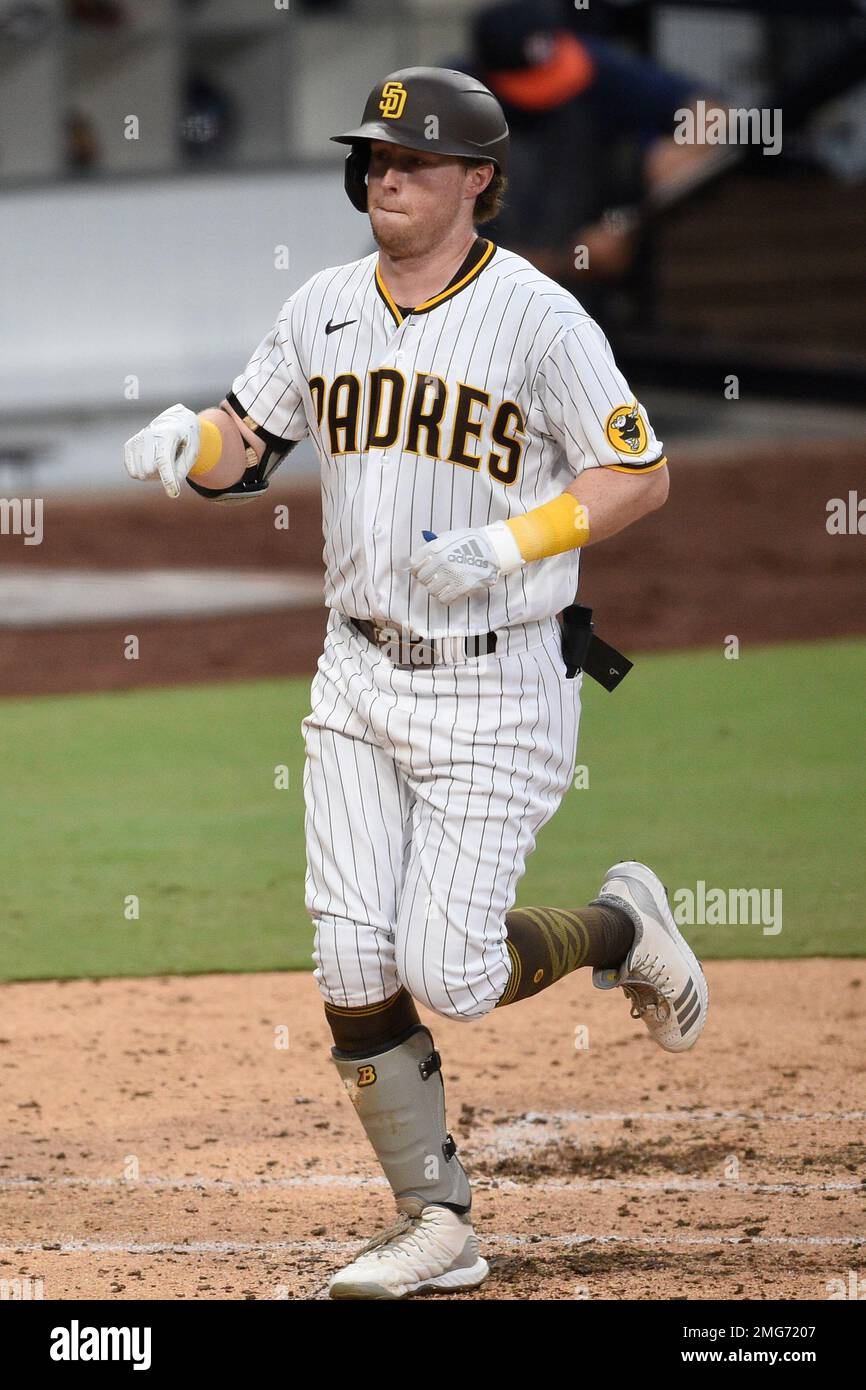 San Diego Padres' Jake Cronenworth reacts after passing home plate off ...