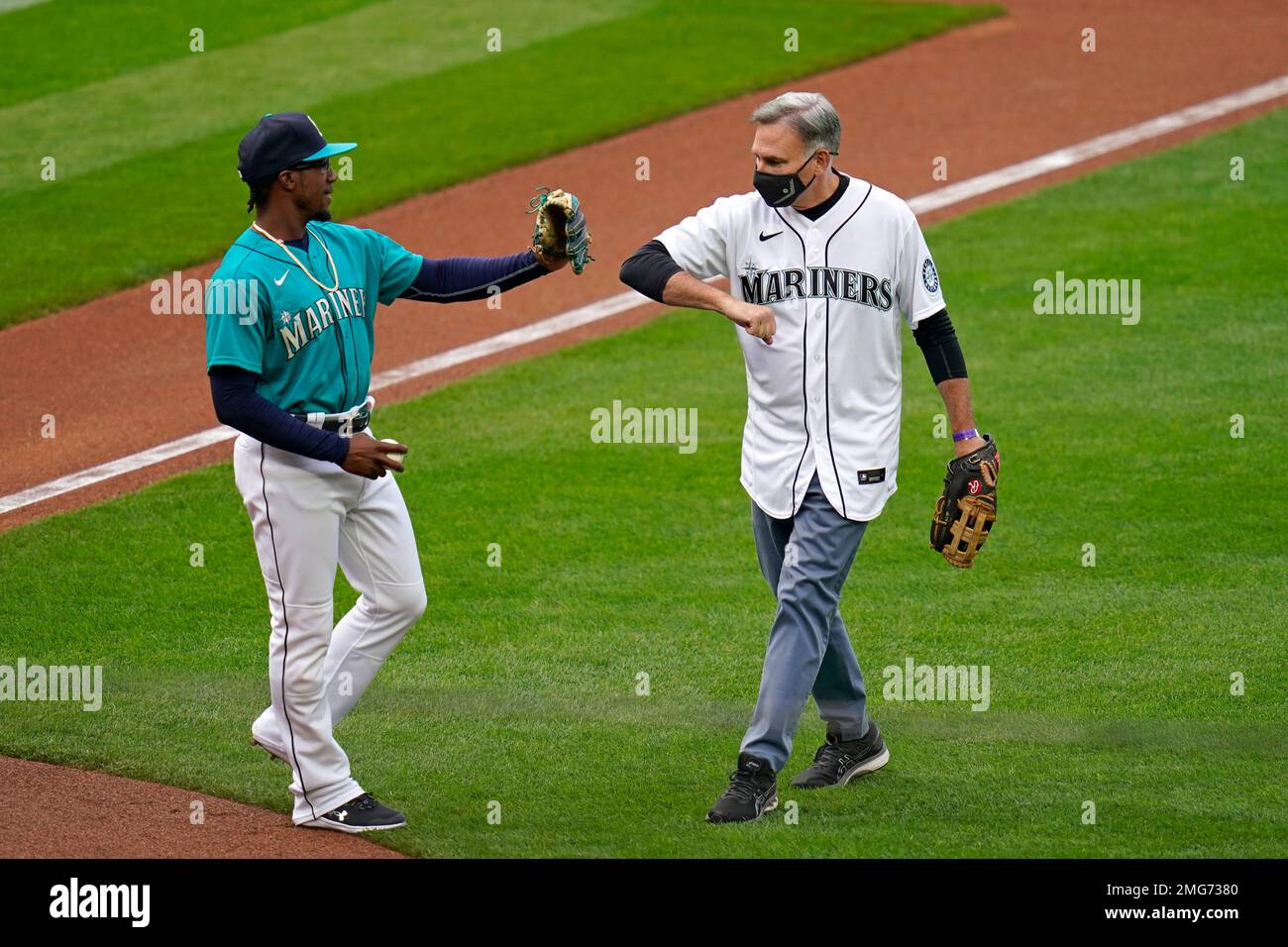 King County Executive Dow Constantine, right, greets Seattle Mariners ...