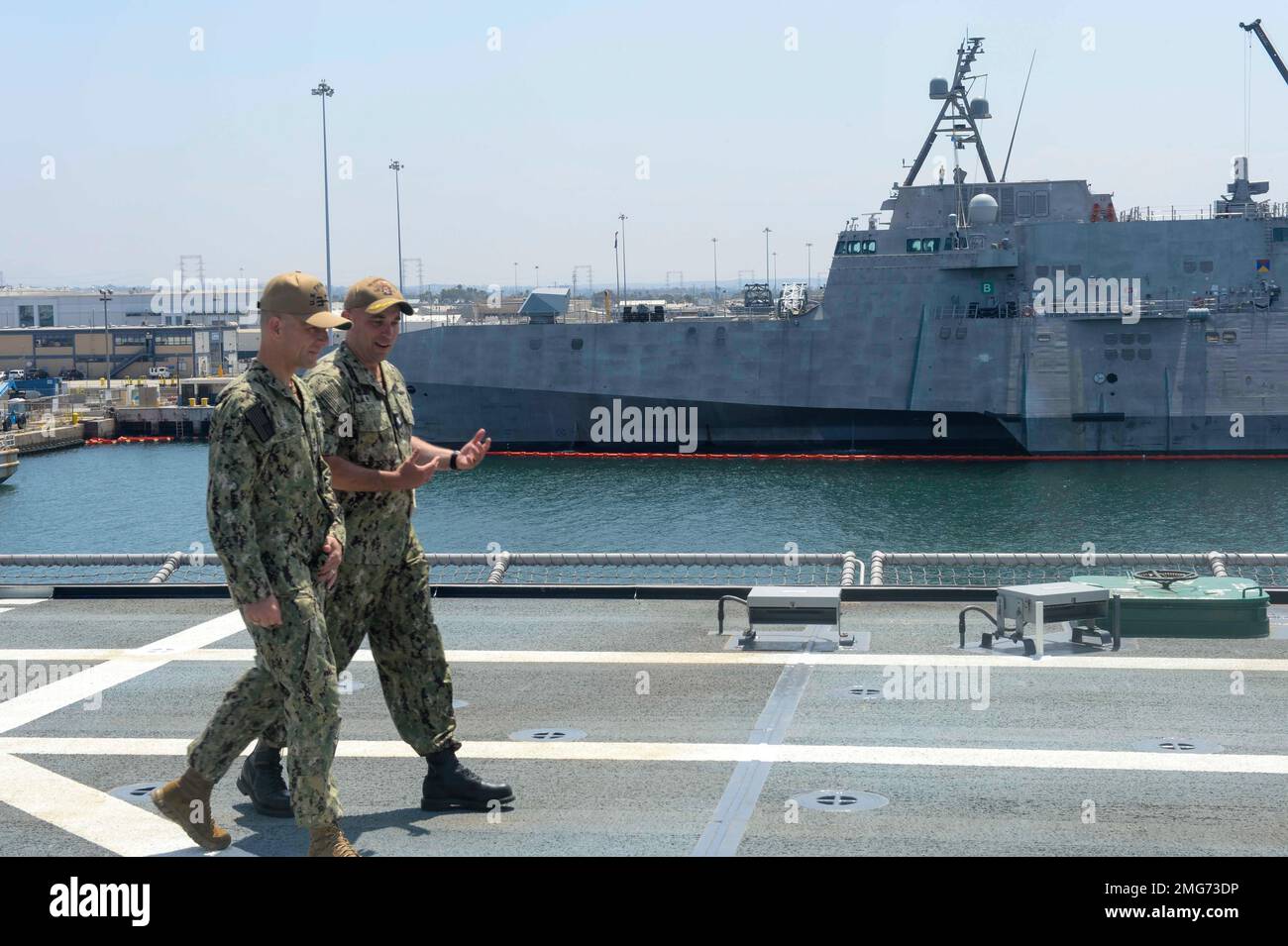220822-N-ZS023-1060 SAN DIEGO (Aug 22, 2022) Cmdr. William Carr, right ...