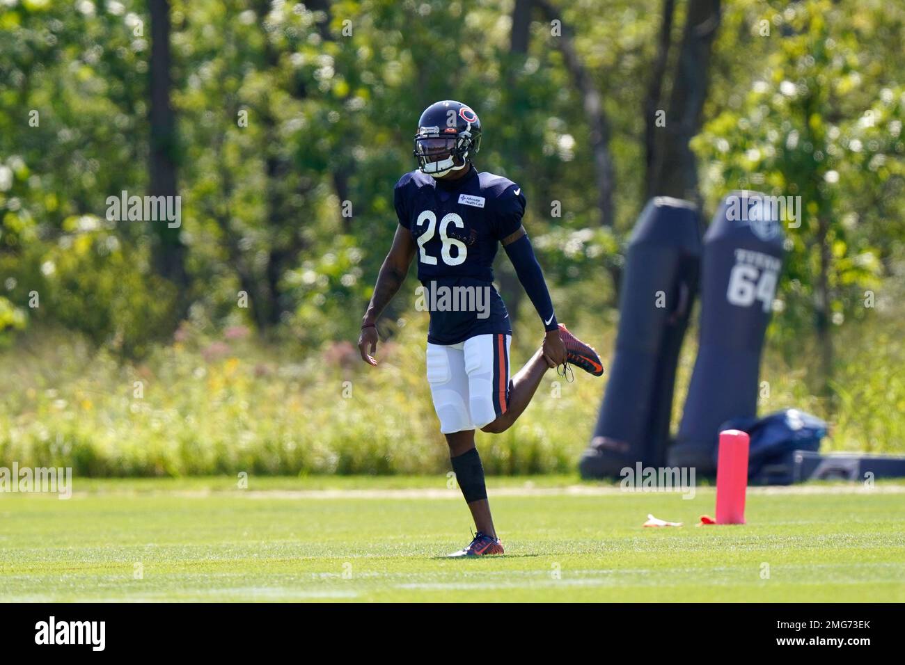 Chicago Bears defensive back Deon Bush stretches on the field during an ...