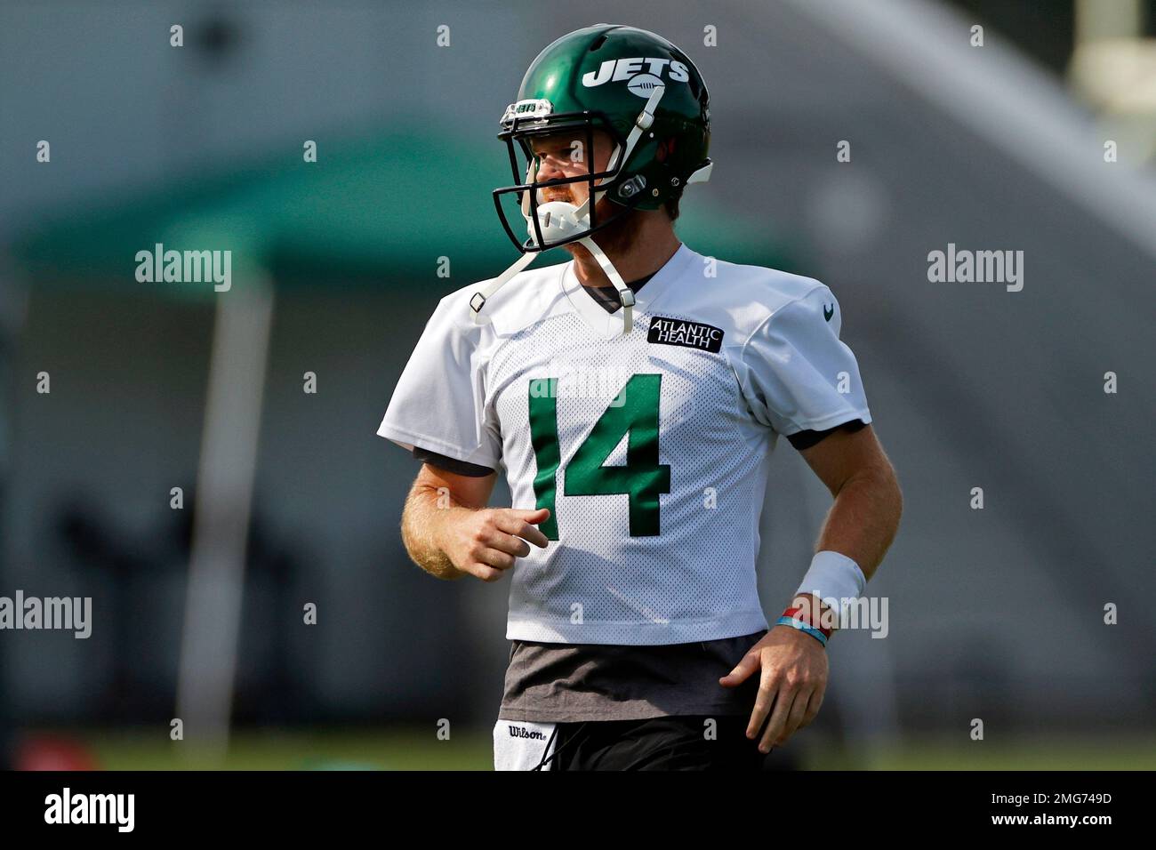 New York Jets quarterback Sam Darnold warms up during a practice at the NFL football team's ...