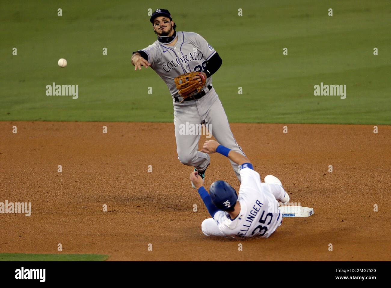 Colorado Rockies third baseman Nolan Arenado, top, makes the relay ...