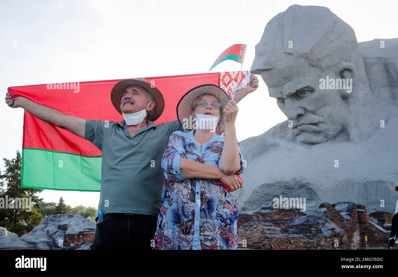 Supporters of Belarusian President Alexander Lukashenko shout holding a ...