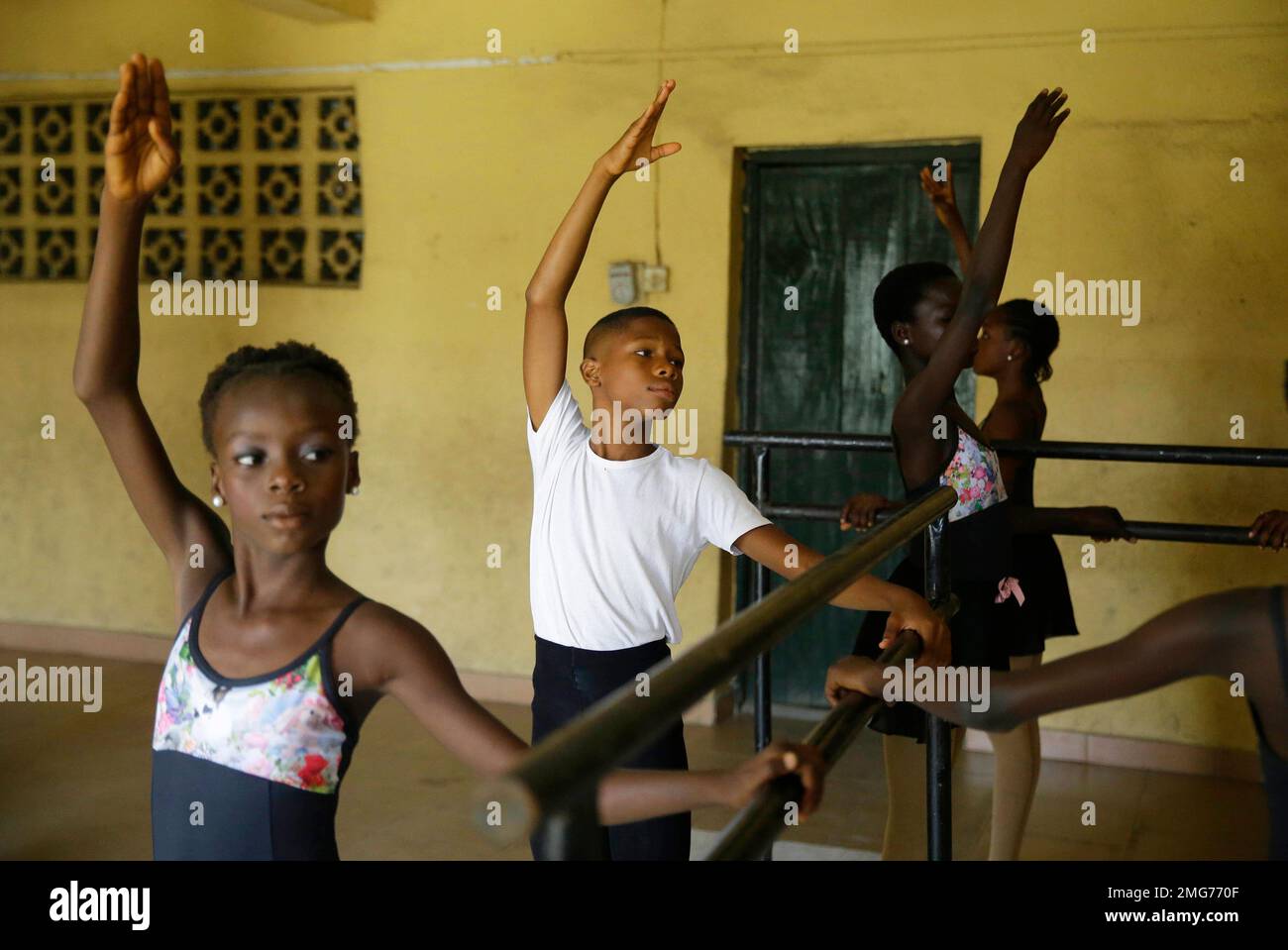 Ballet dancer Anthony Mmesoma Madu, center, rehearses with other dance ...