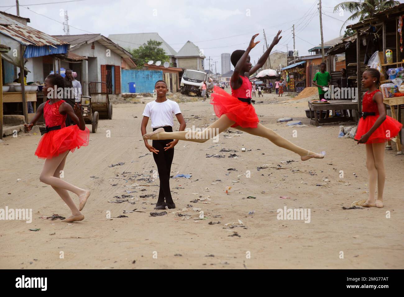 Ballet student Anthony Mmesoma Madu, center, stands in position as ...