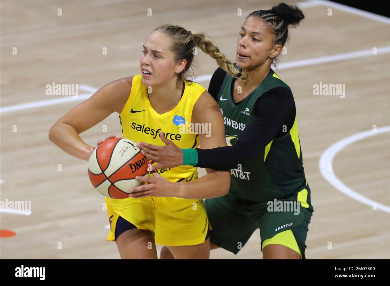 Indiana Fever's Kathleen Doyle, left, is defended against by Seattle ...