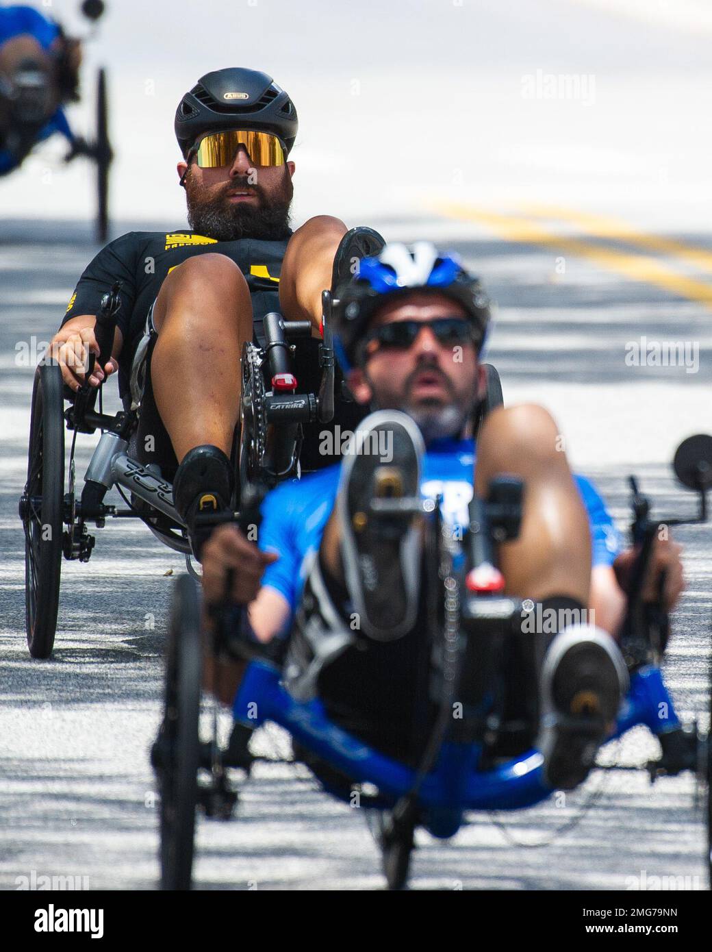 Retired U.S. Army Sgt. Justin Mathers, center, competes against members ...