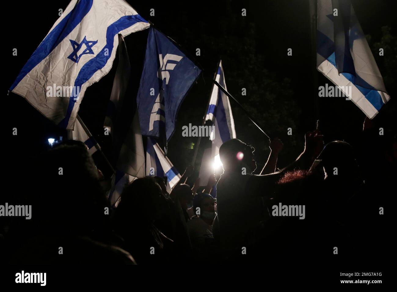Supporters of Israeli Prime Minister Benjamin Netanyahu wave national ...