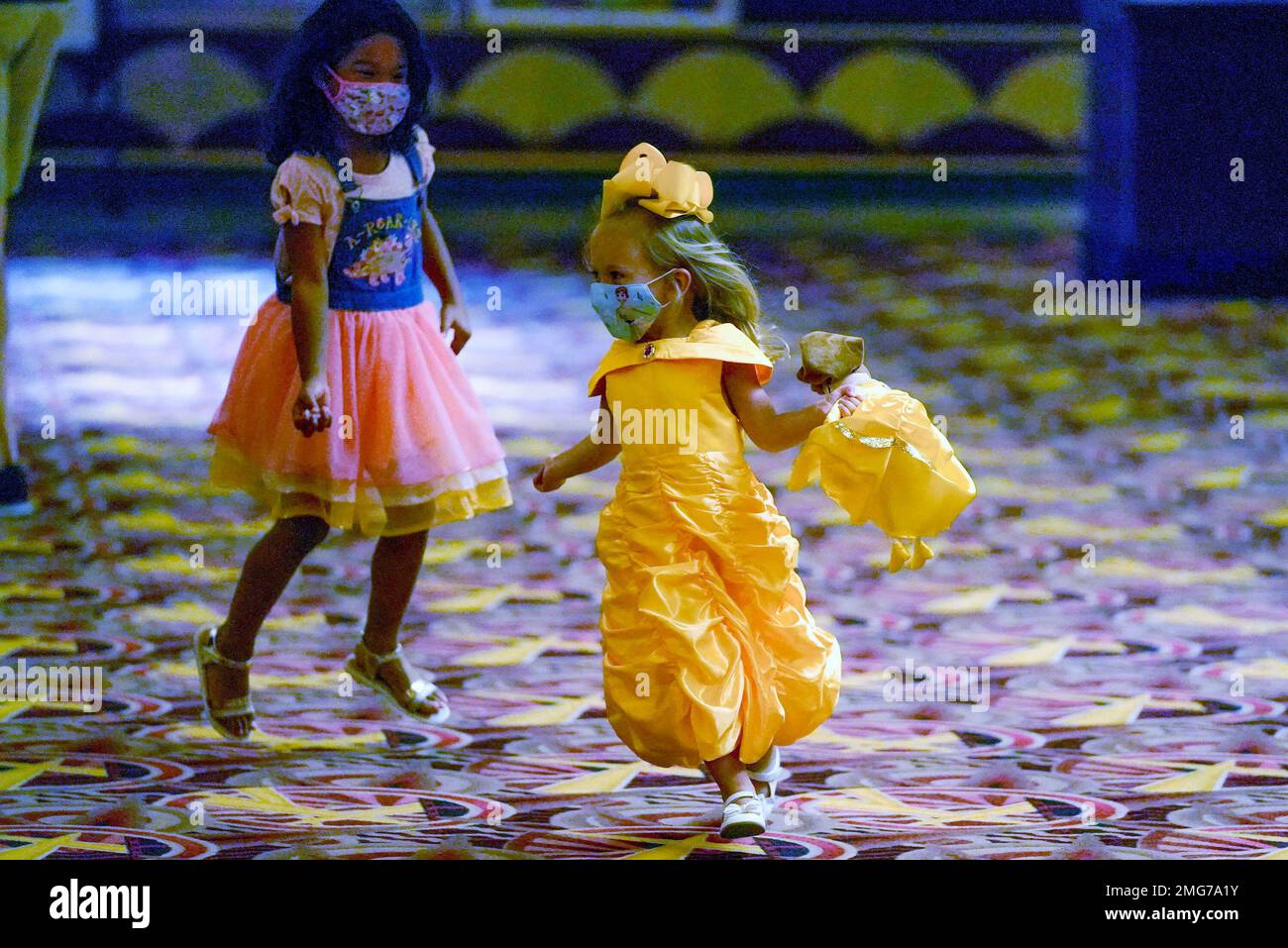 Emely Frahis, 5, chases three-year-old Lilly Stevenson, right, around ...