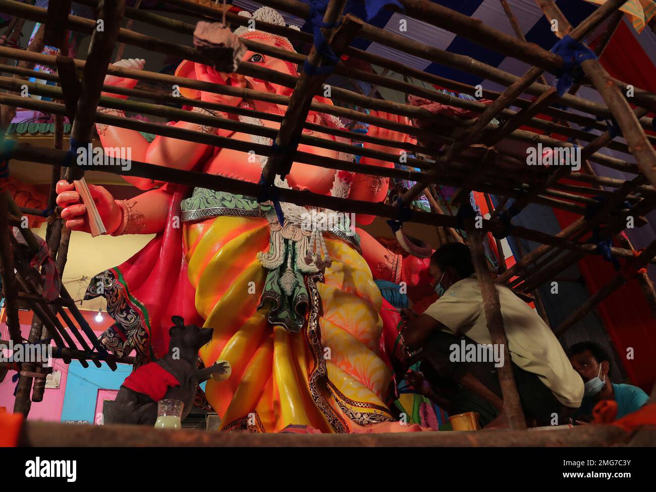 An Indian artist paints an idol of elephant-headed Hindu god Ganesha ...