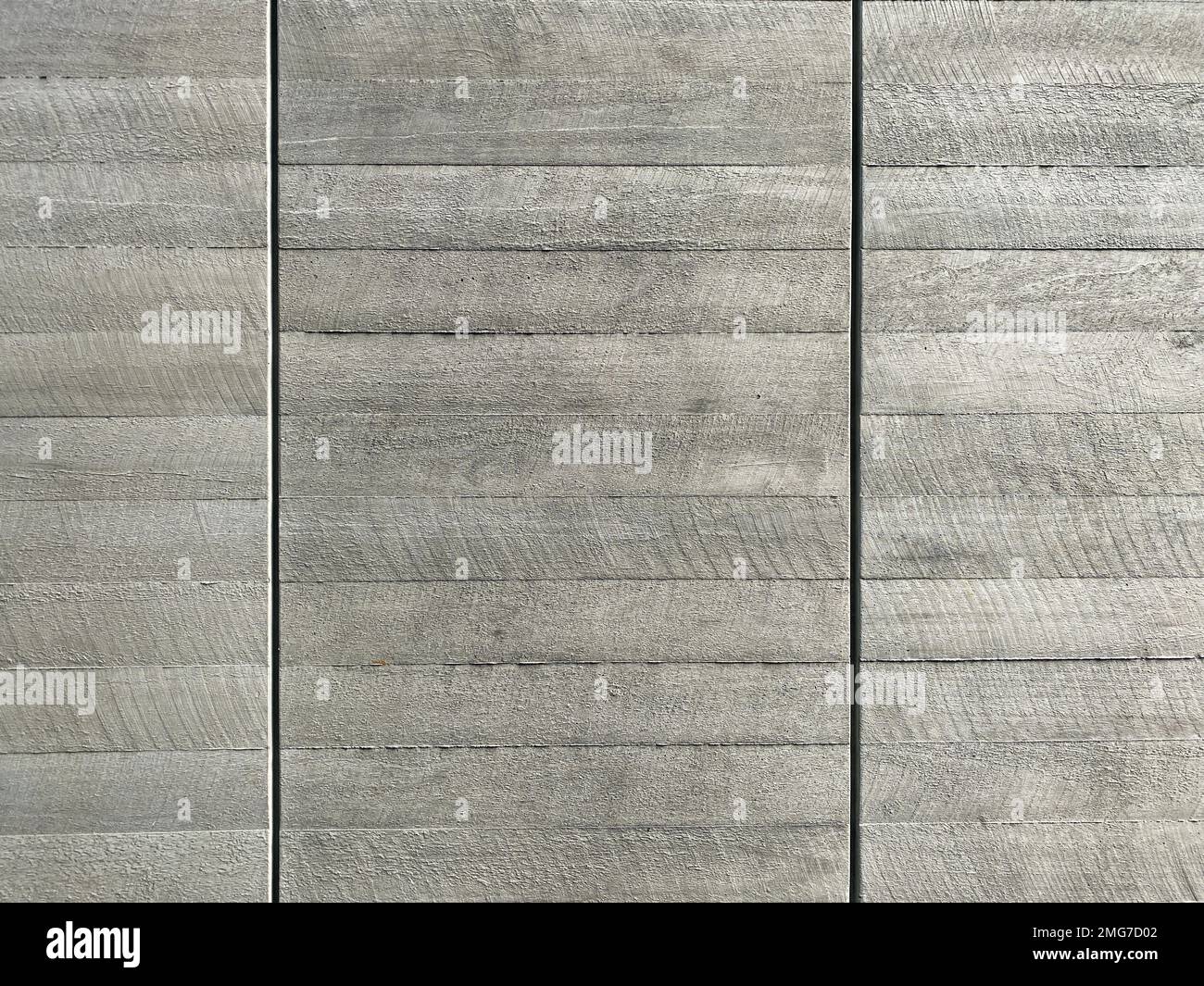Close-up of a precast tilt slap concrete wall background with wood ...