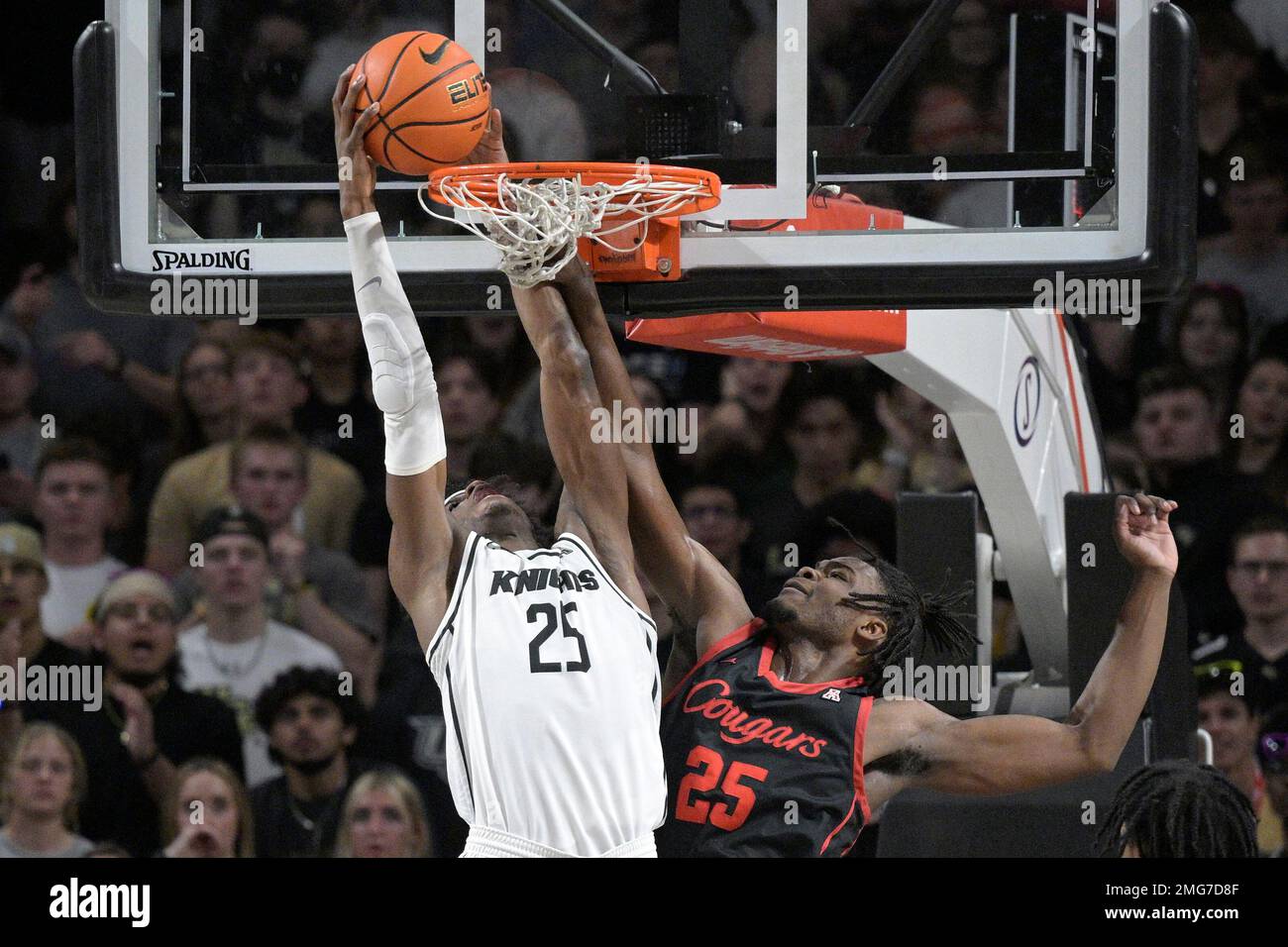 Central Florida forward Taylor Hendricks (25), left, dunks as Houston ...