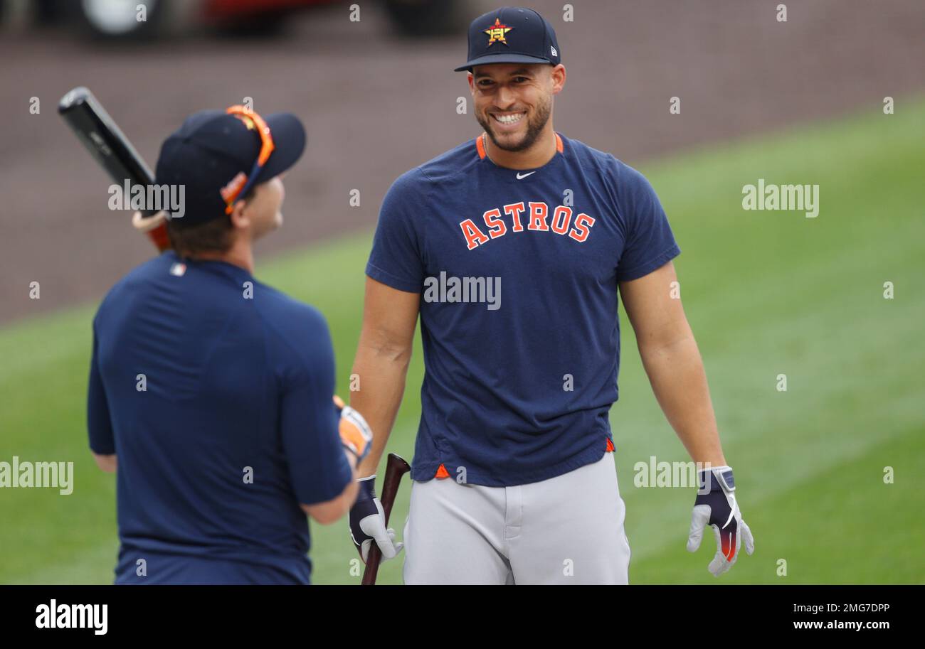 Houston Astros center fielder George Springer, back, jokes with right ...