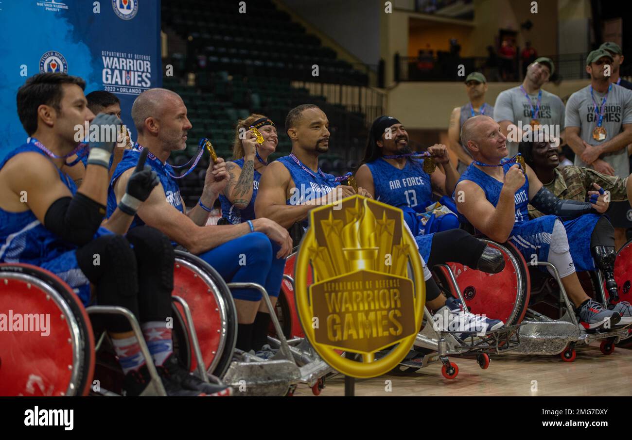 Team Air Force’s wheelchair rugby team shows off their medals after ...