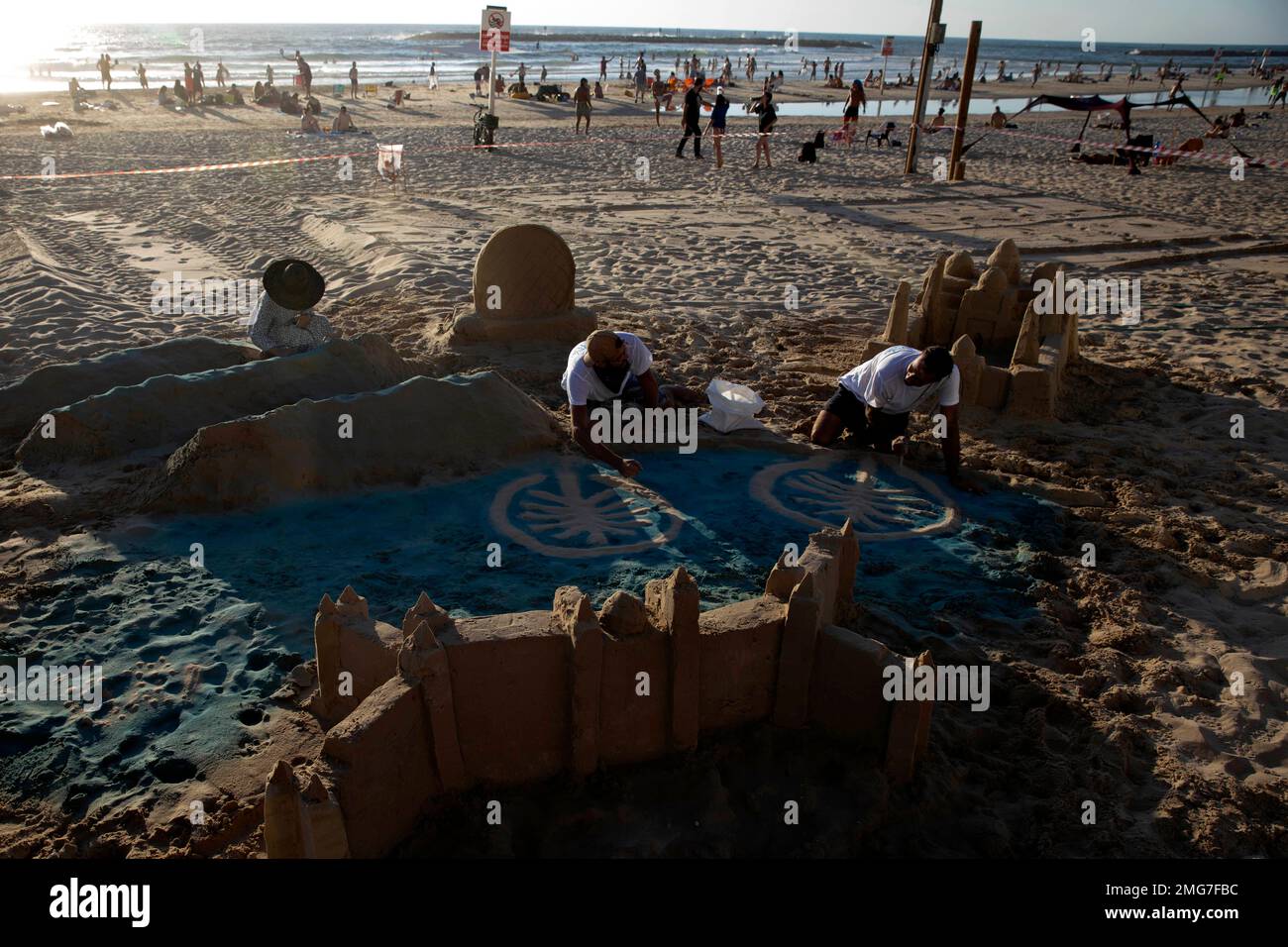 Israeli sand sculptors work on sculptures of UAE's distinctive ...