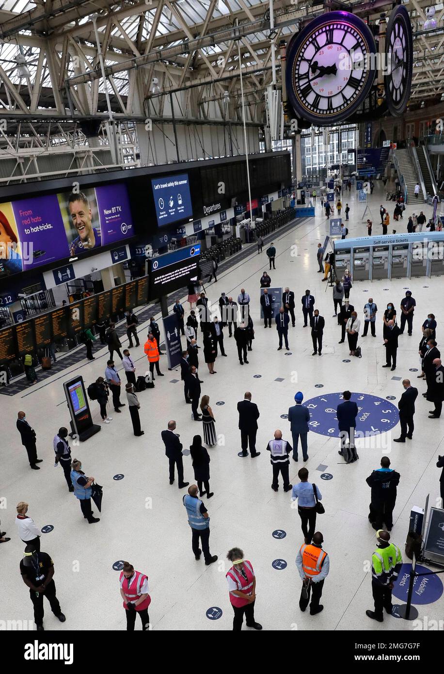 People observe a minutes silence to remember those involved in the ...