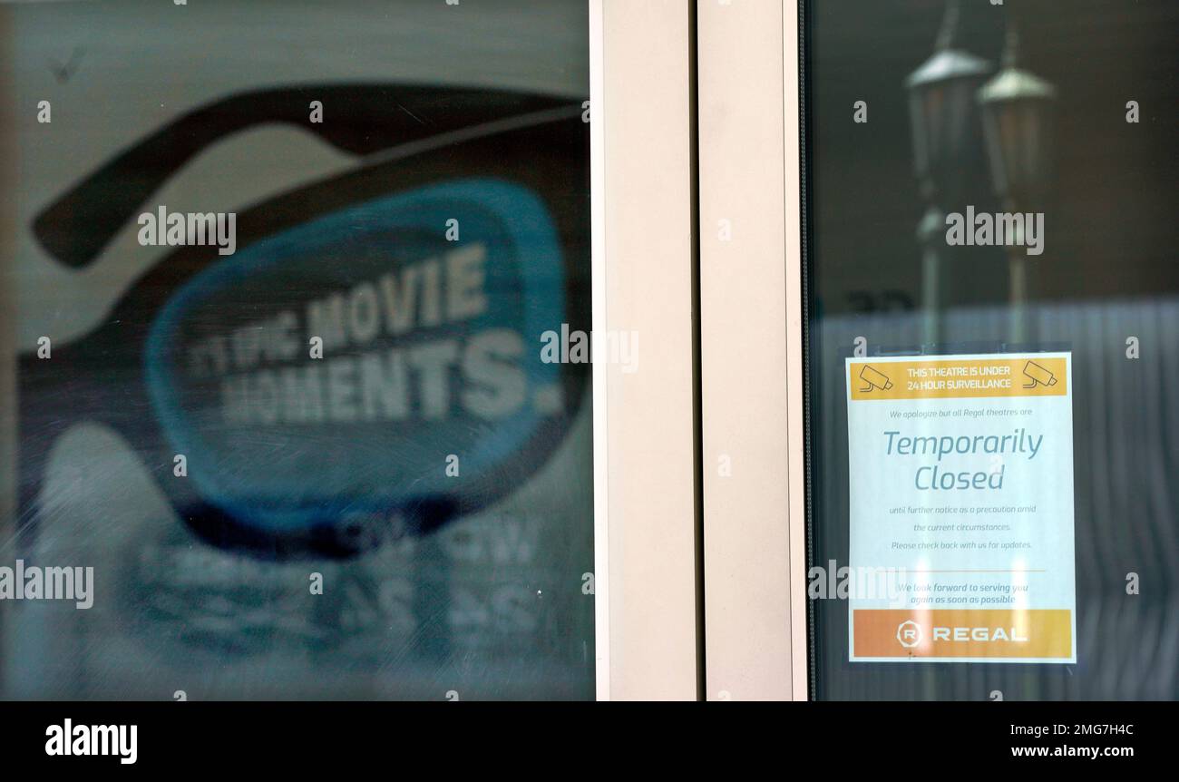 A "temporarily closed" sign is pictured on a door to the Regal Cinemas ...
