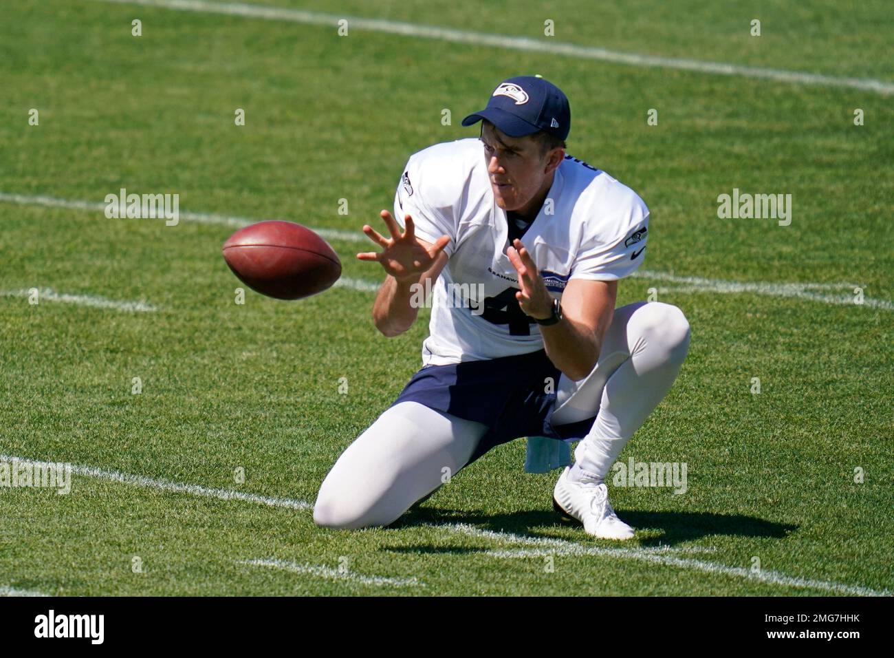 Seattle Seahawks punter Michael Dickson reaches for the ball Tuesday ...