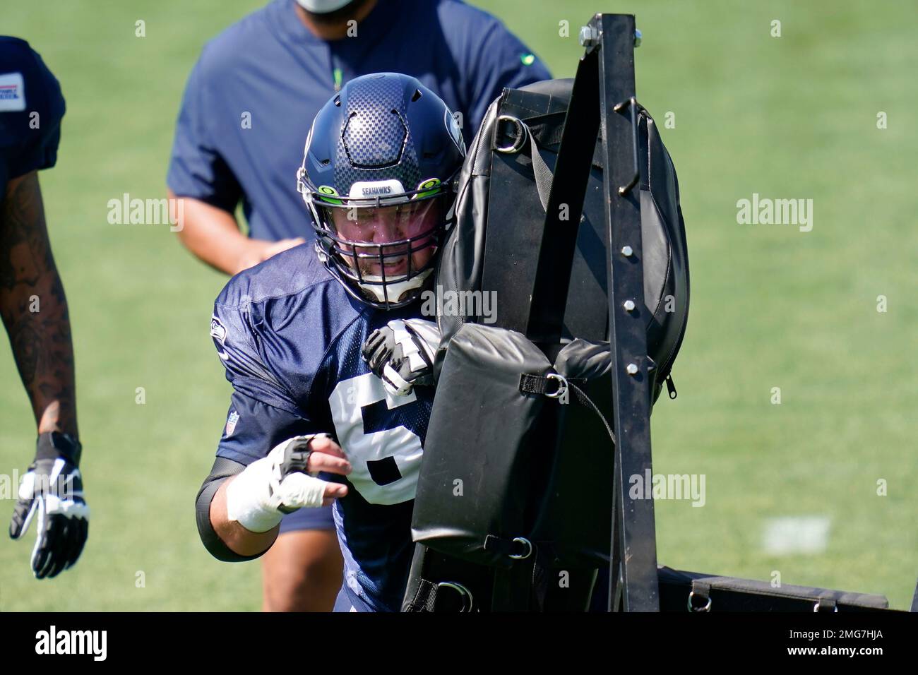 Seattle Seahawks center B.J. Finney hits a tackling dummy Tuesday, Aug ...
