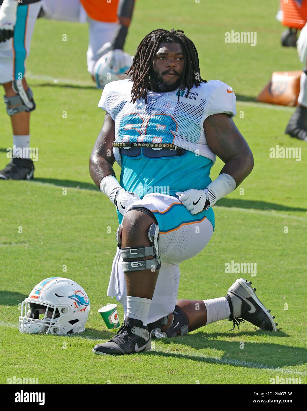 Miami Dolphins guard Solomon Kindley (66) stretches prior to an NFL ...