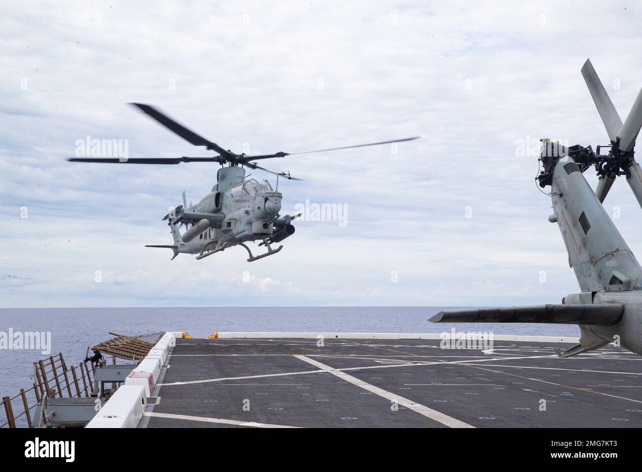 A U.S. Marine Corps AH-1Z Cobra attack helicopter with Marine Medium ...