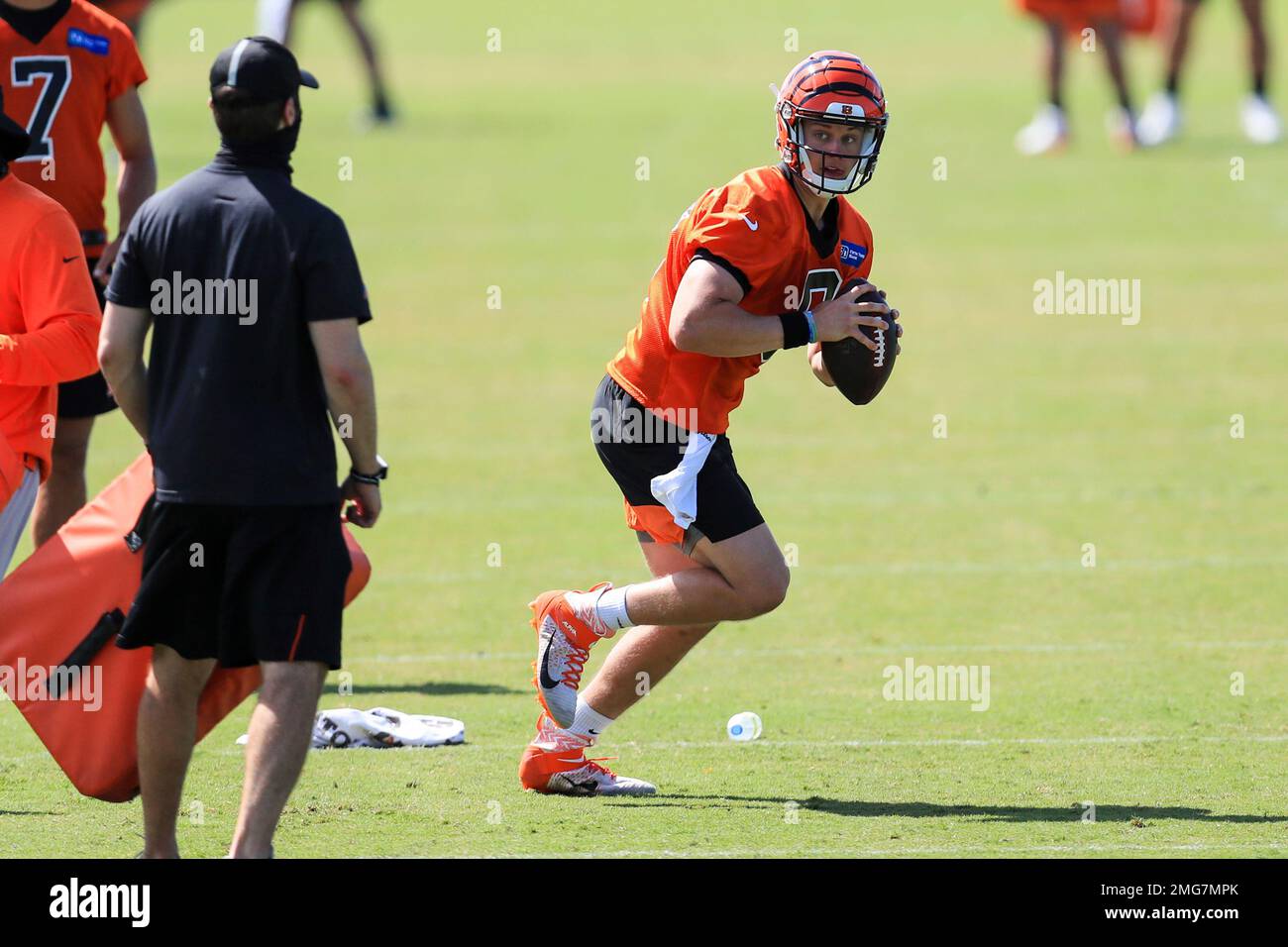 Cincinnati Bengals' Joe Burrow (9) scrambles as he looks to pass during ...
