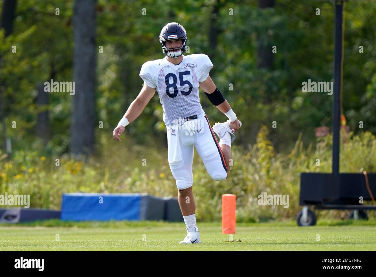 Chicago Bears tight end Cole Kmet stretches on the field during an NFL ...