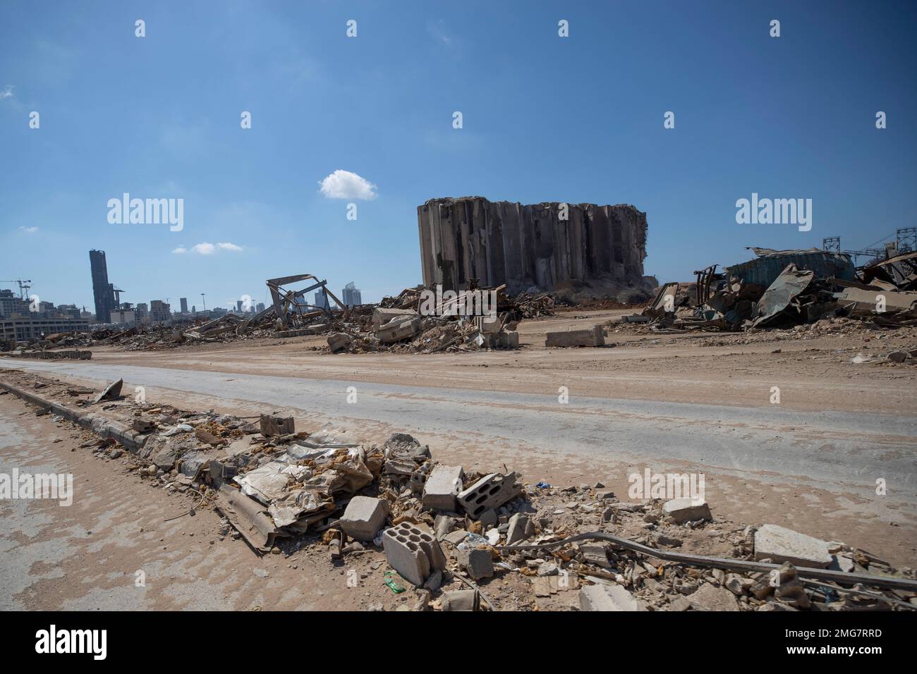 A damaged grain silo is surrounded by rubble and debris at the at the ...