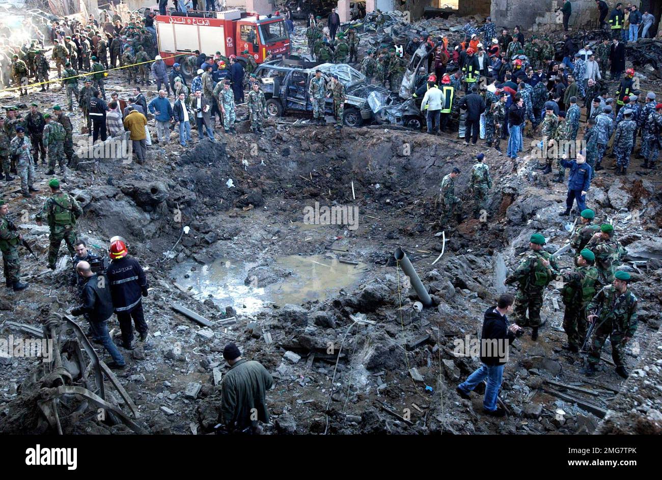 FILE - In this Feb. 14, 2005 file photo, rescue workers and soldiers ...