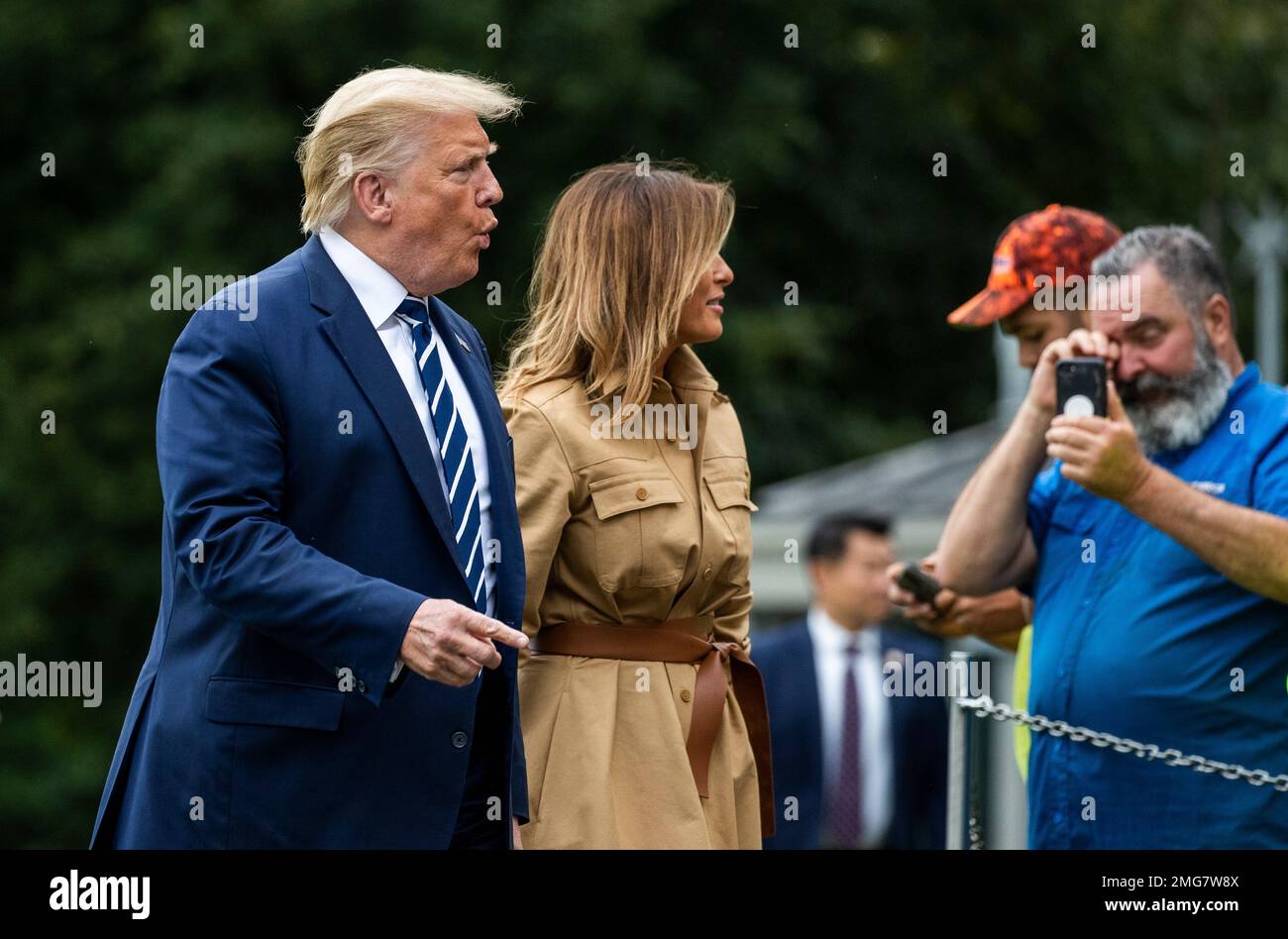 President Donald Trump with first lady Melania Trump greets workers and ...