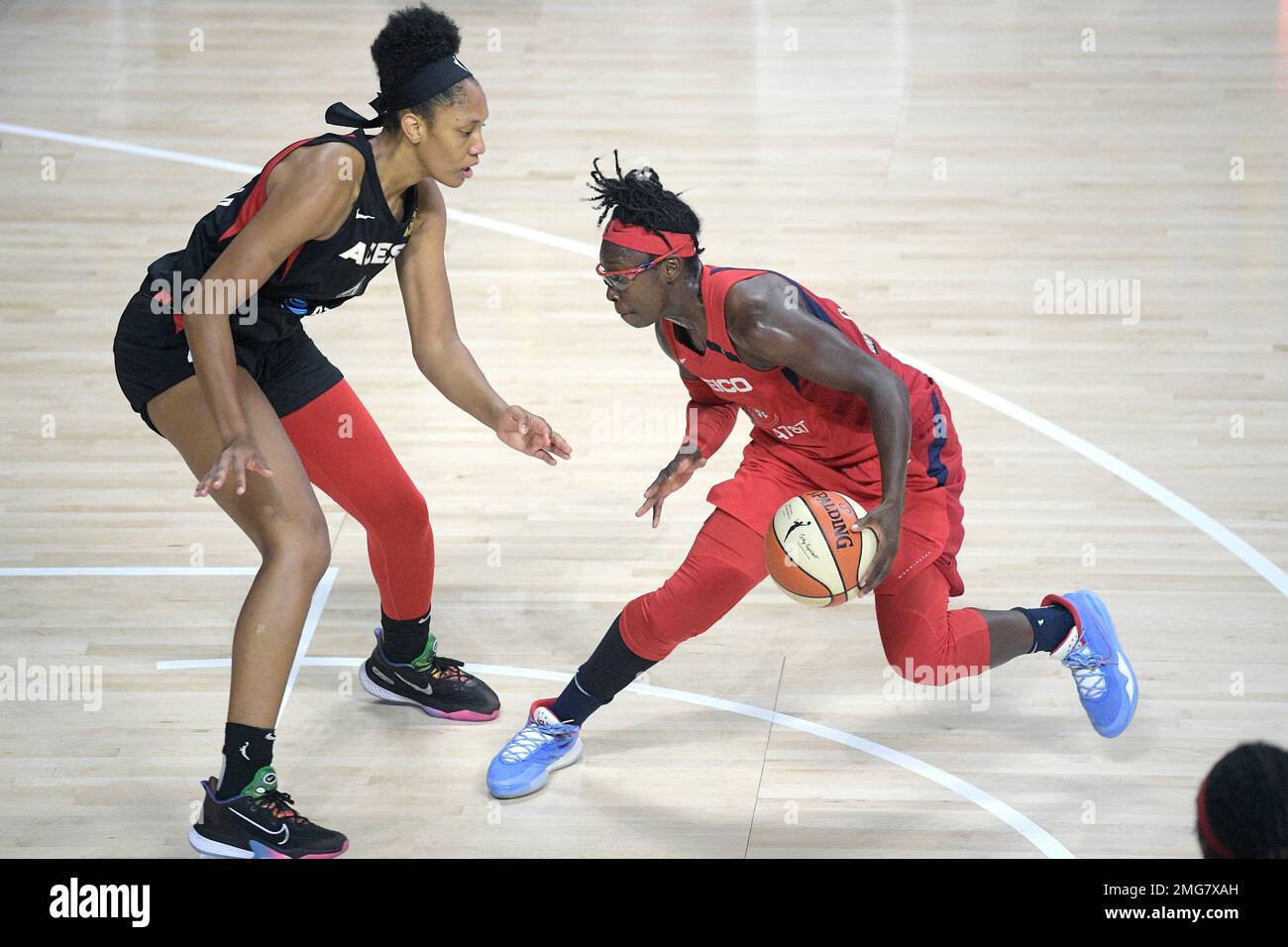 Washington Mystics forward Essence Carson, right, sets up for a shot in ...