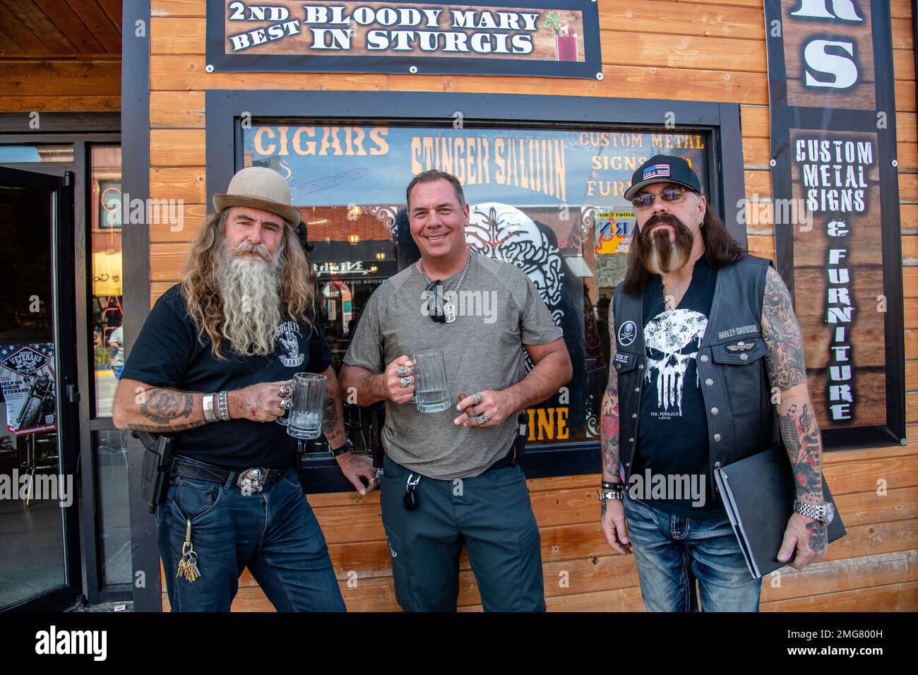 Bikers pose for a photo outside of the Stinger Saloon during the 80th ...
