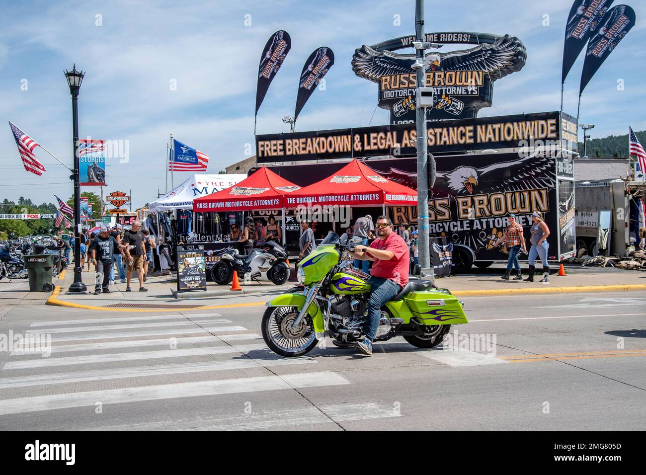 A biker rides down Main Street during the 80th annual Sturgis ...