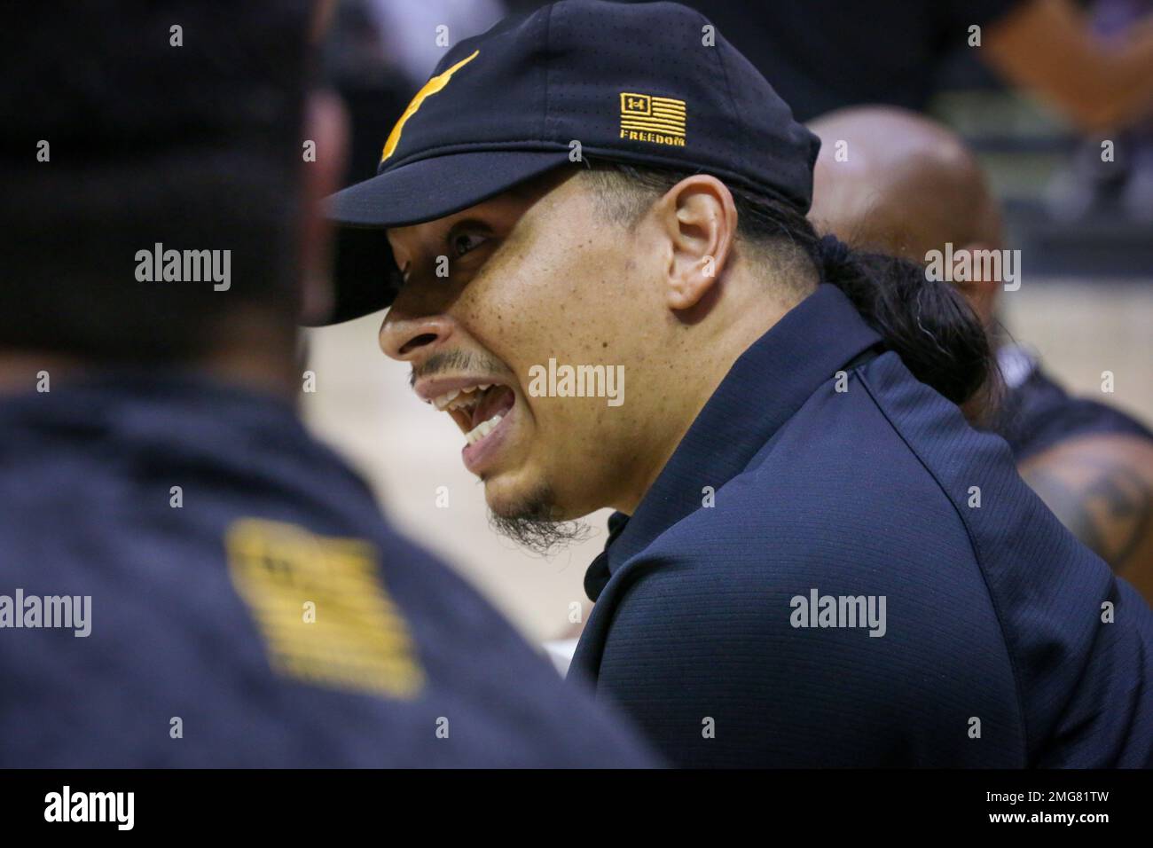 Retired U.S. Army Staff Sgt. Joel Rodriguez offers encouragement to ...