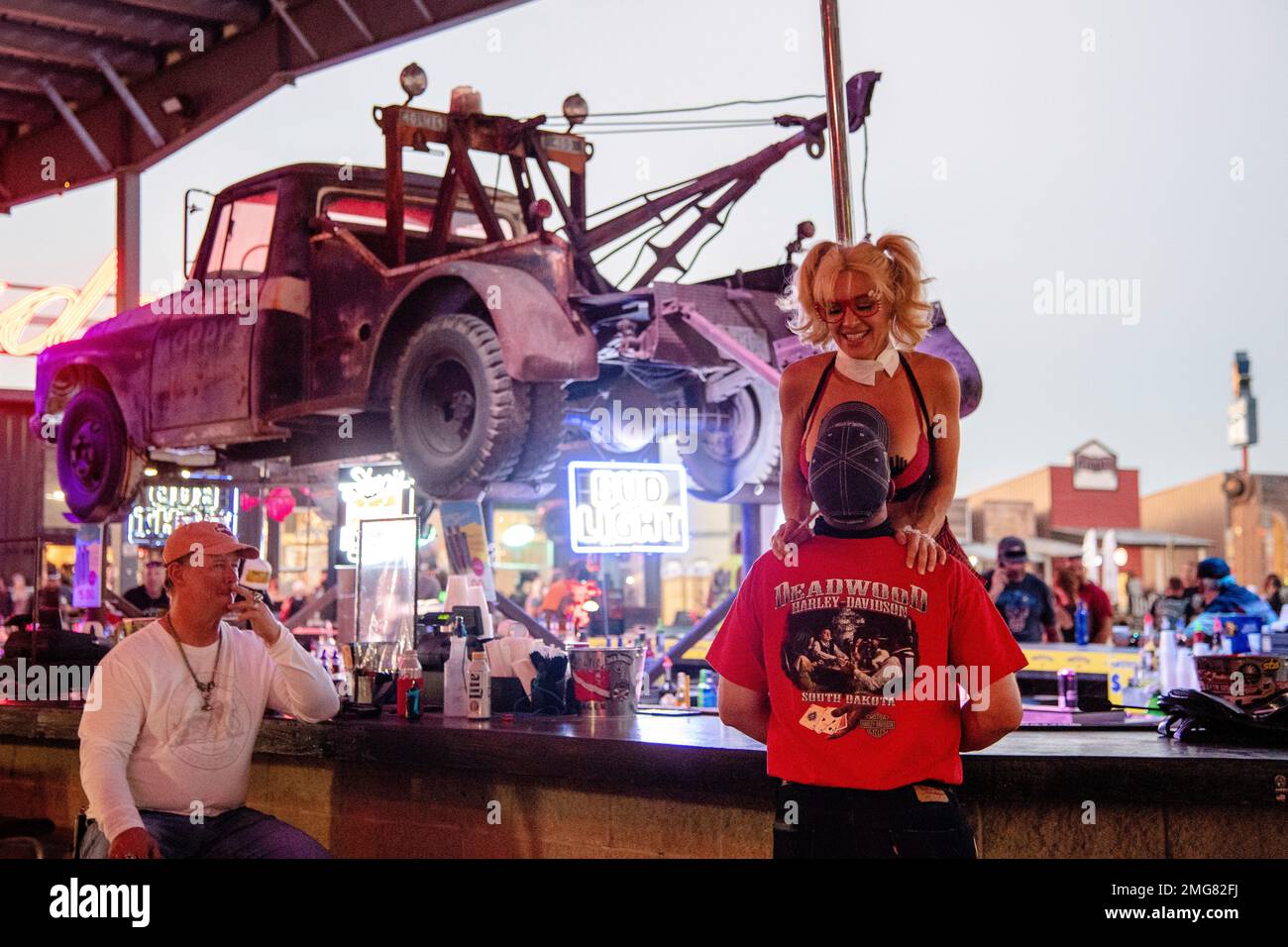 A dancer performs on a bar at the Full Throttle Saloon during the 80th ...