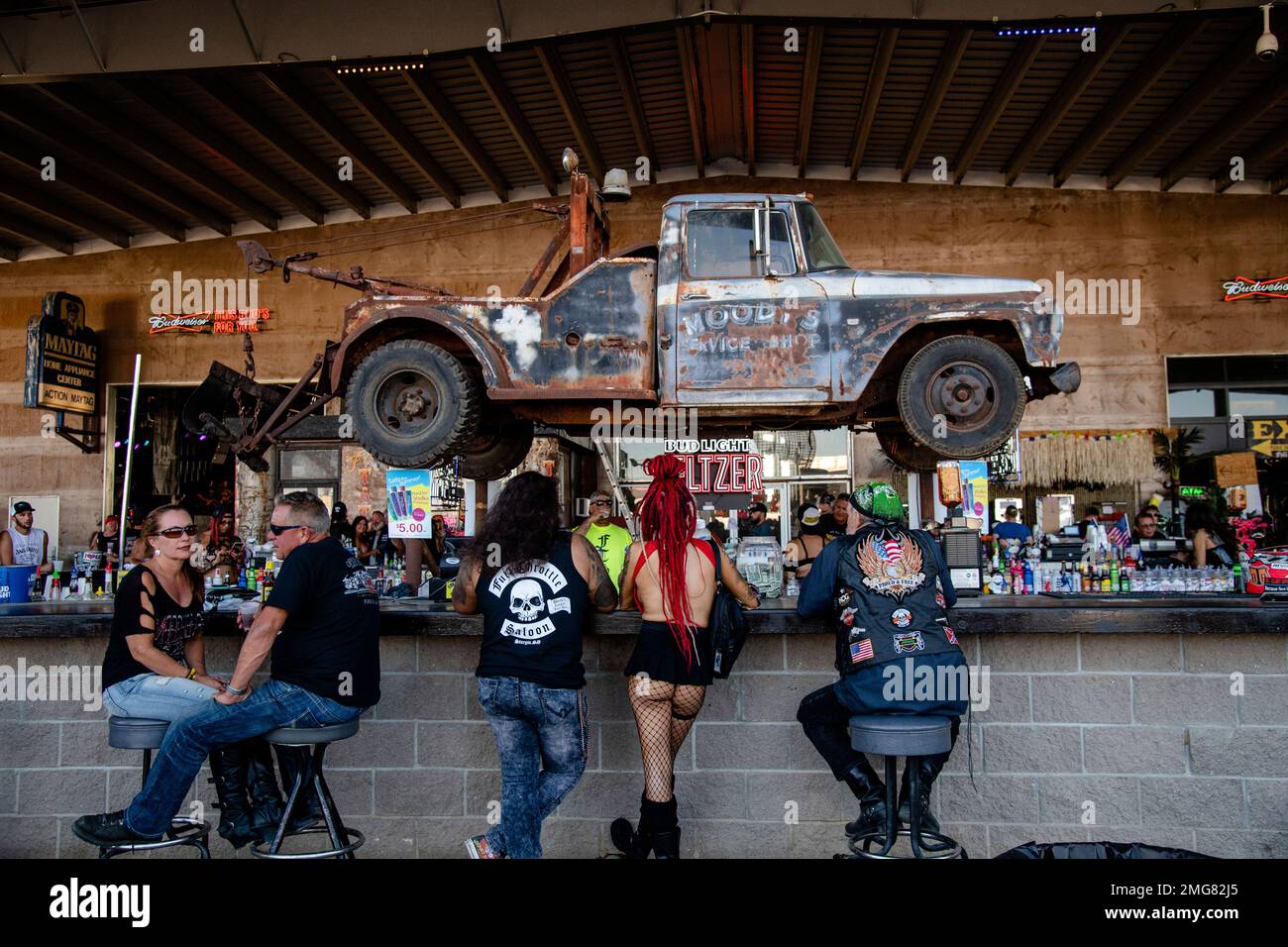 Patrons sit at the bar at the Full Throttle Saloon during the 80th ...