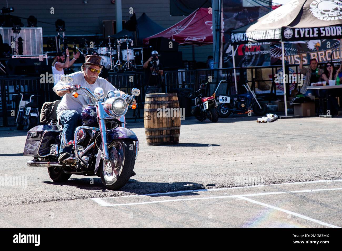 A biker participates in a barrel race at the Broken Spoke Saloon during ...