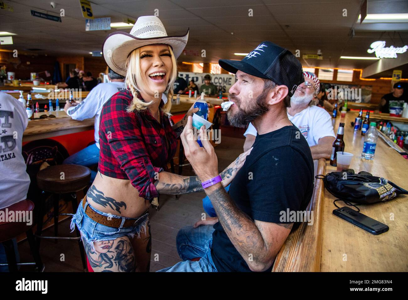 A bar patron receives a jello shot with whipped cream at One Eyed Jacks Saloon during the 80th ...