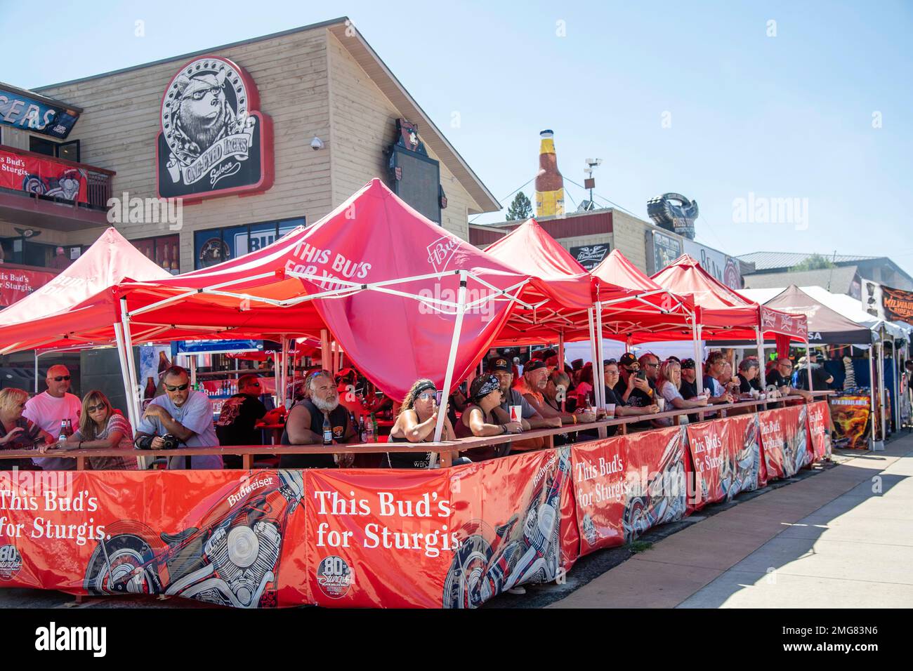 People gather at an outside bar at One Eyed Jacks Saloon during the ...