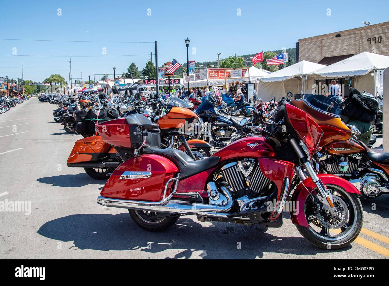 Motorcycles are lined up along Main Street during the 80th annual ...