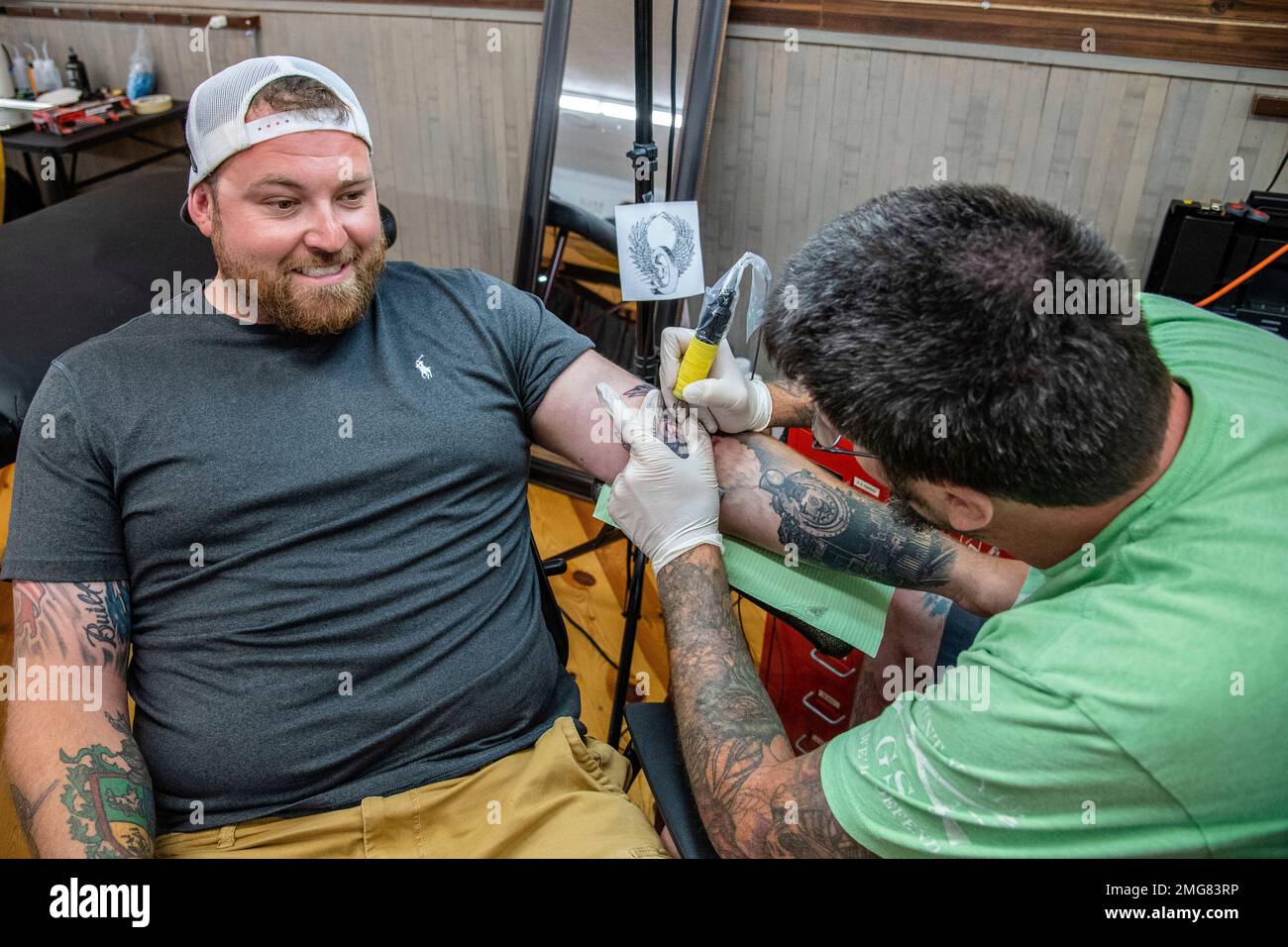 Brandon Taranto receives a tattoo by artist Oddly Strange James during ...
