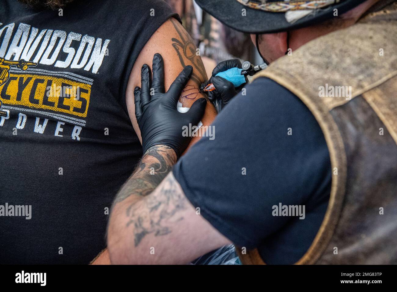 Sean Toyra is tattooed by Isaac Velasco during the 80th annual Sturgis ...