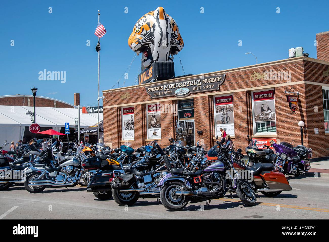Motorcycles are lined up in front of the Sturgis Motorcycle Museum ...