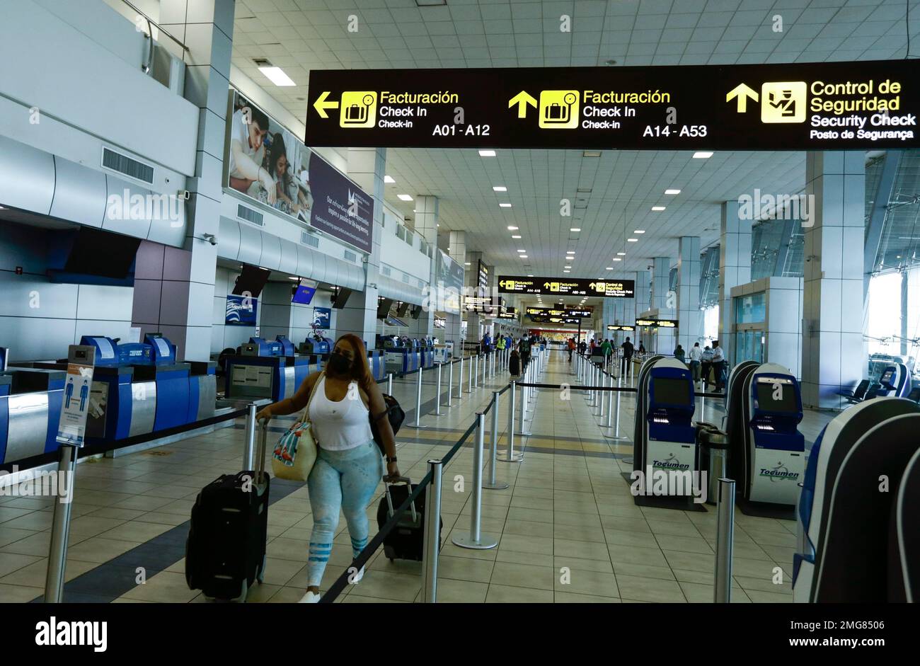 A passenger walks to the check-in of Copa Airlines to board a flight ...