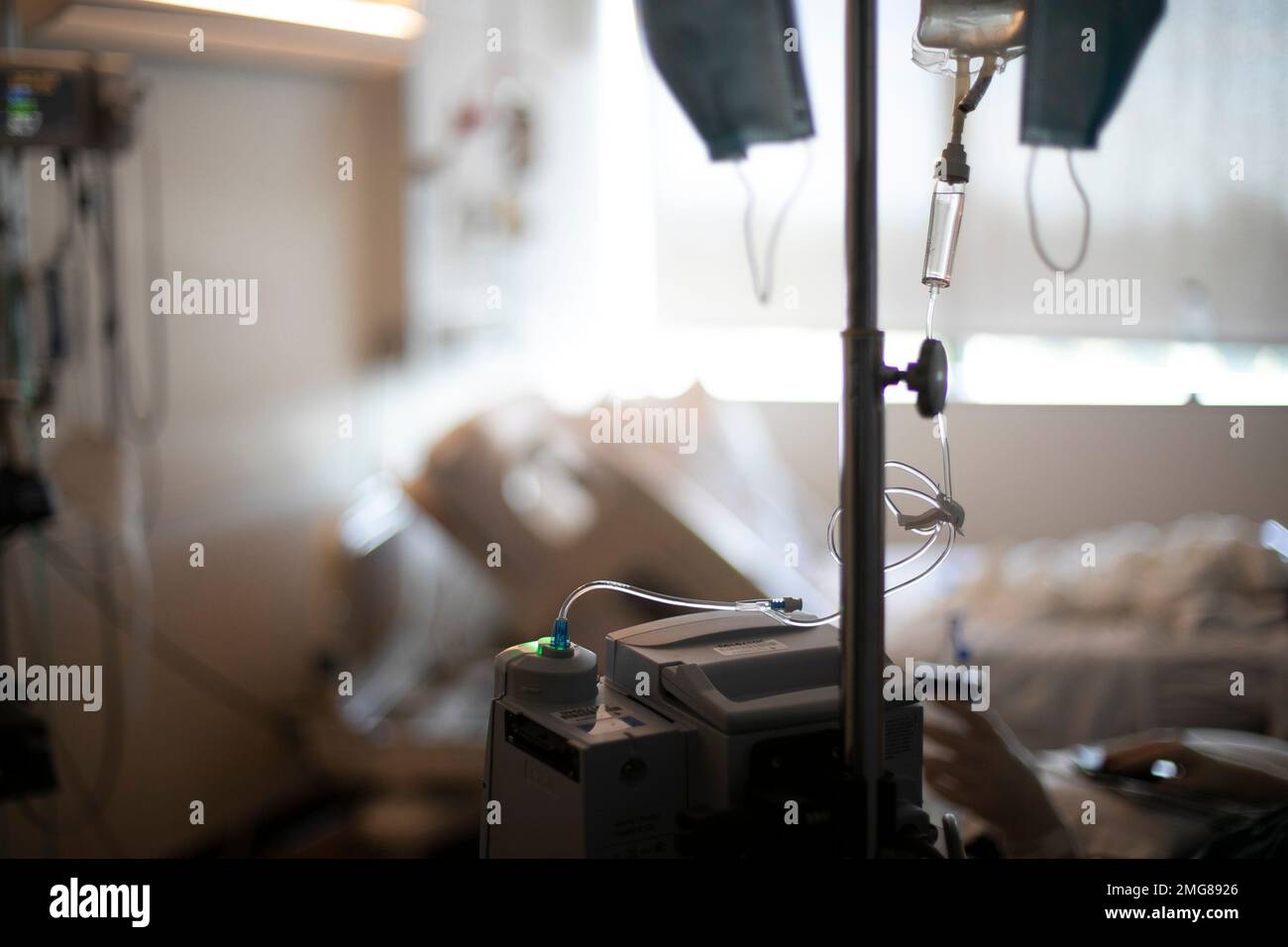 In this Aug. 8, 2020, photo a patient receives an IV drip as face masks ...
