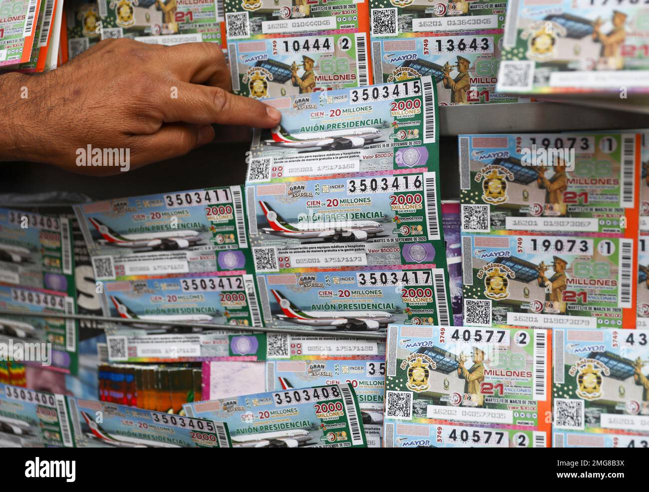 FILE - In this March 10, 2020 file photo, a vendor shows lottery ...